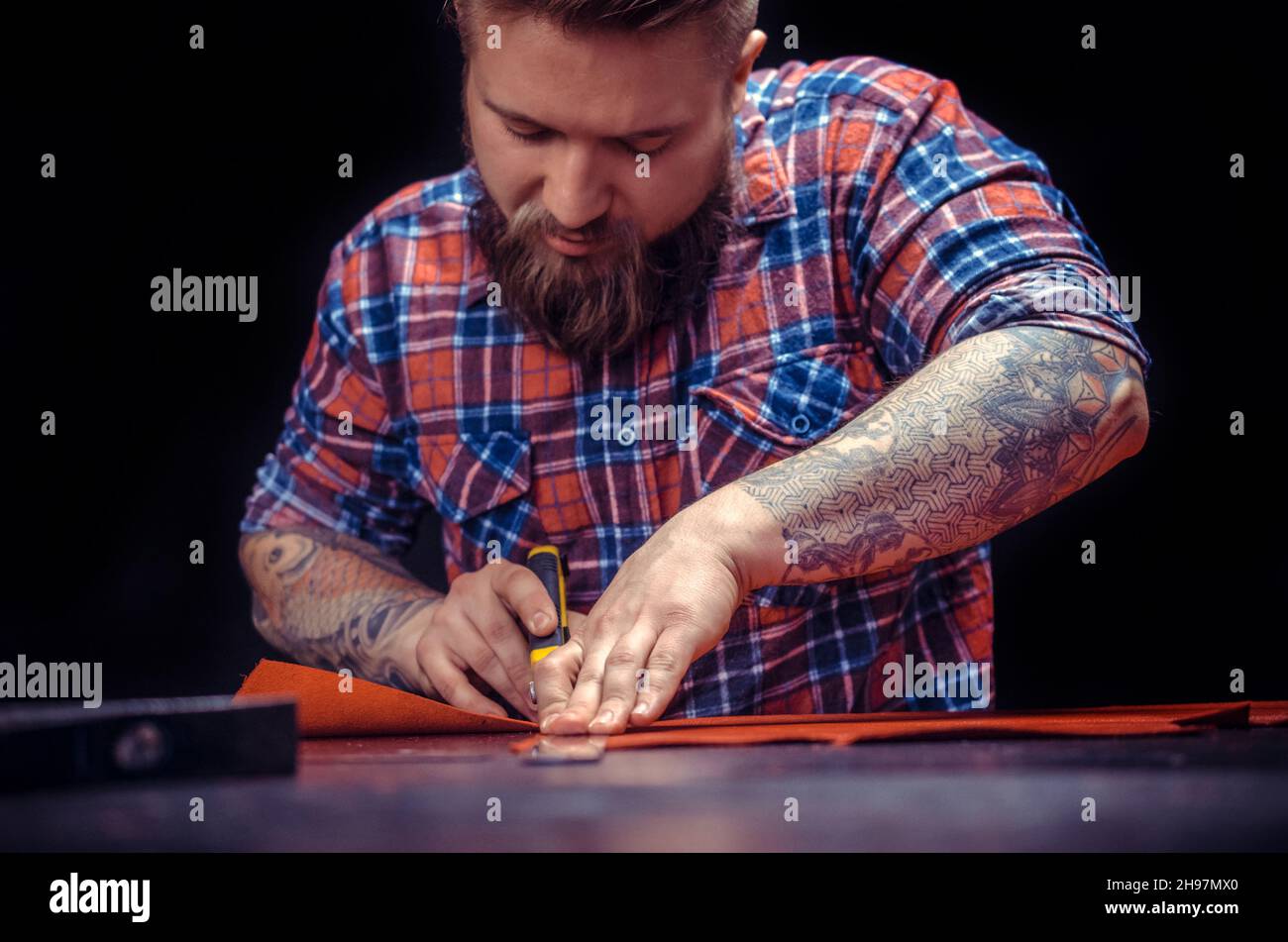 Leather Currier forms new leather product at his workshop Stock Photo ...