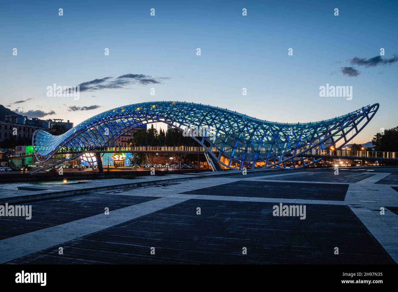 Scenic view of the glass-and-steel pedestrian Peace Bridge over the ...
