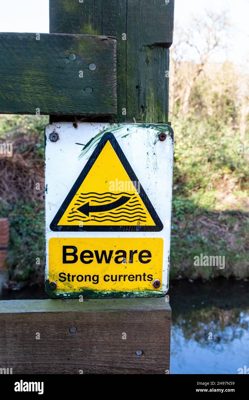 A warning sign telling passers by to Beware Strong Current at the ...