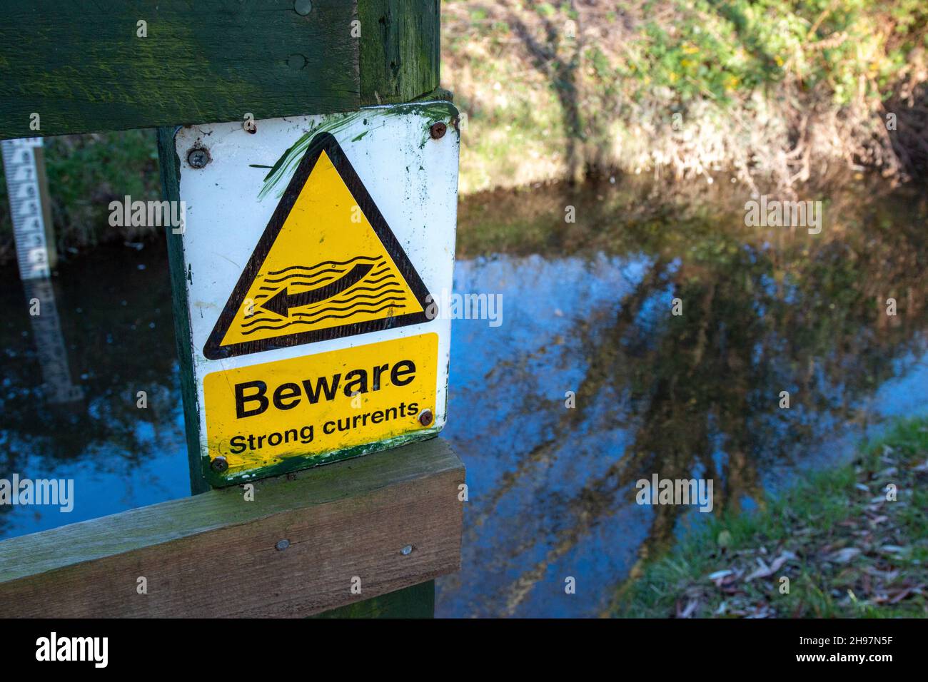 A warning sign telling passers by to Beware Strong Current at the ...