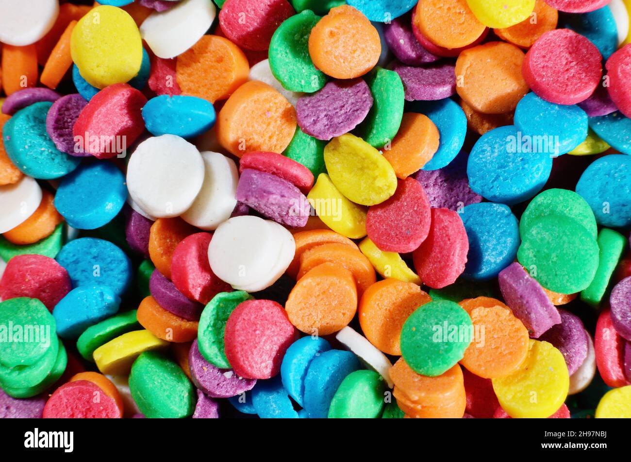 Multicolor sprinkles macro background photo Stock Photo - Alamy