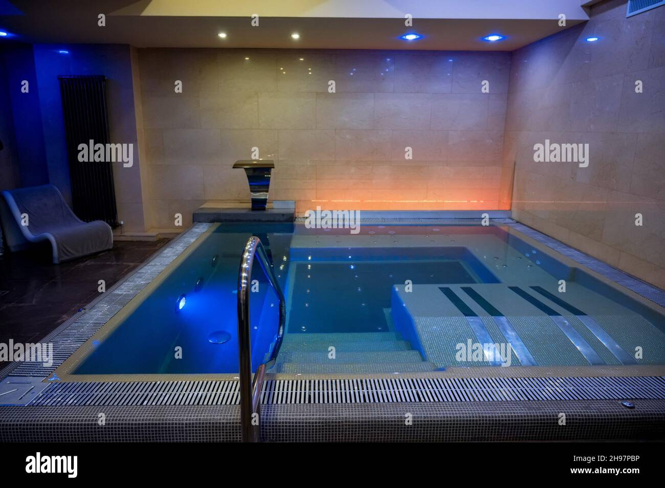 Room in a sauna with a small swimming pool Stock Photo - Alamy