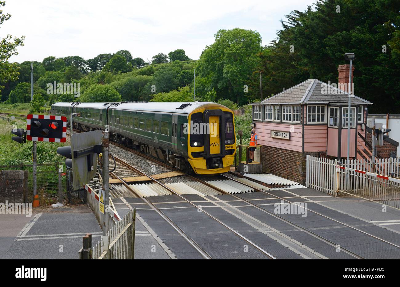 A train arrives at Crediton station signalbox from Barnstaple, with the ...