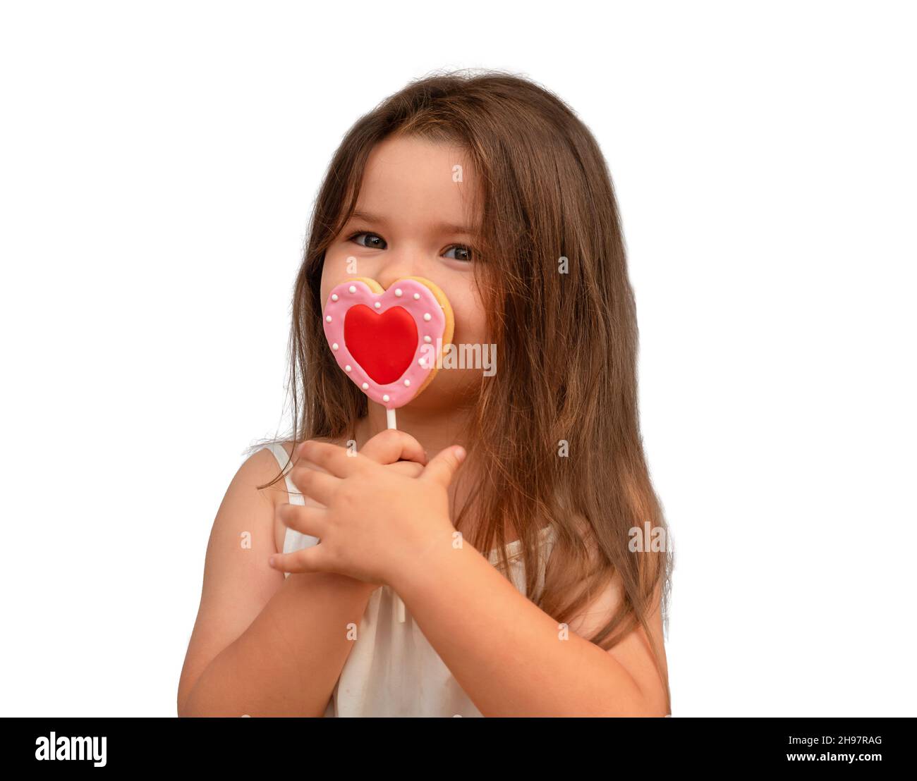 Girl with heart cookies isolate. Child holding sweetness on a stick on ...