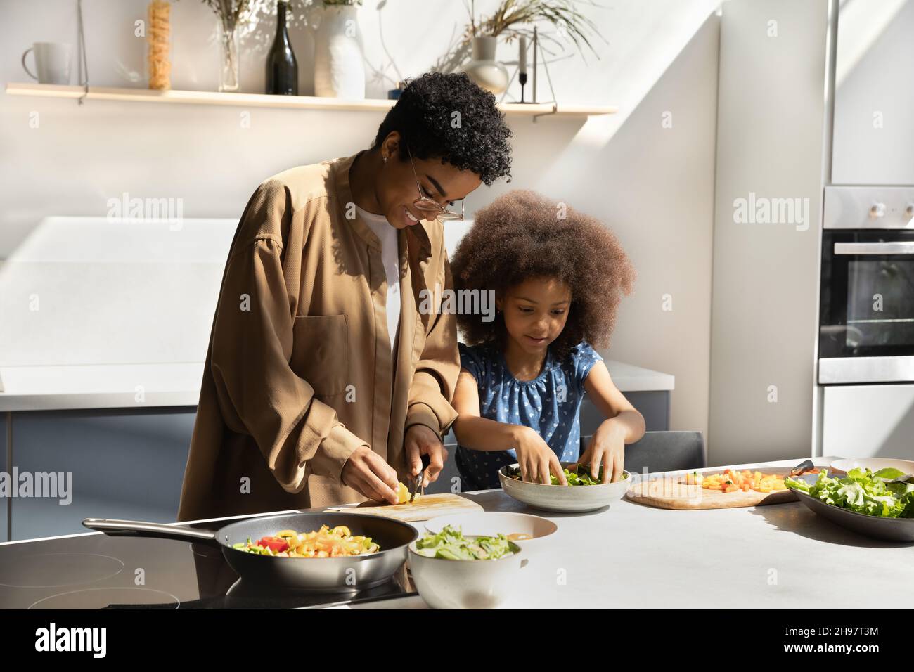 Happy two generations African American family cooking at home Stock ...