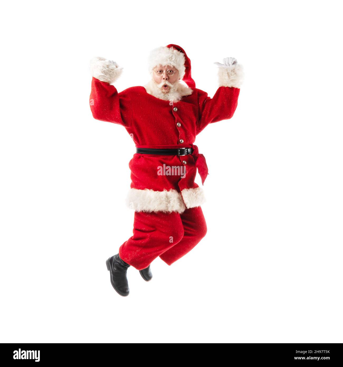 Santa Claus jumping, full length portrait isolated on white background ...
