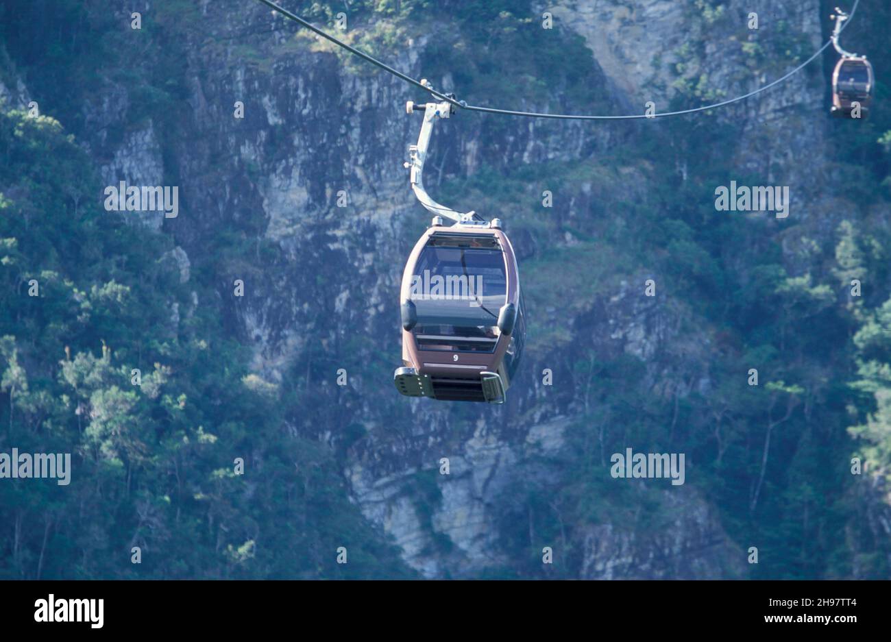 a cable car at the jungle Landscape at the Mountain area of Gunung ...
