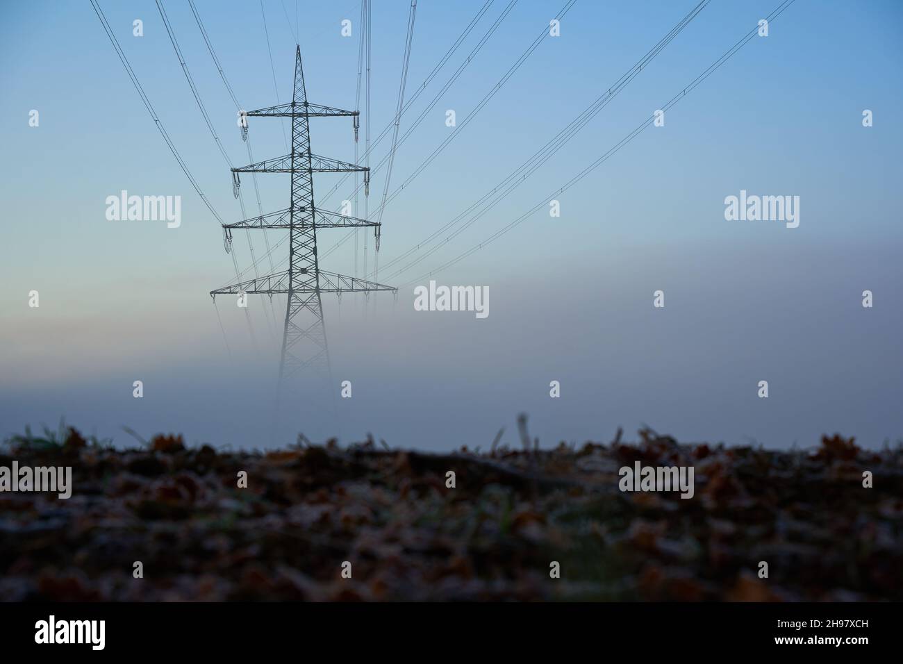 Dark Soil in front of a Large Electricity pylon (Strommasten) also ...