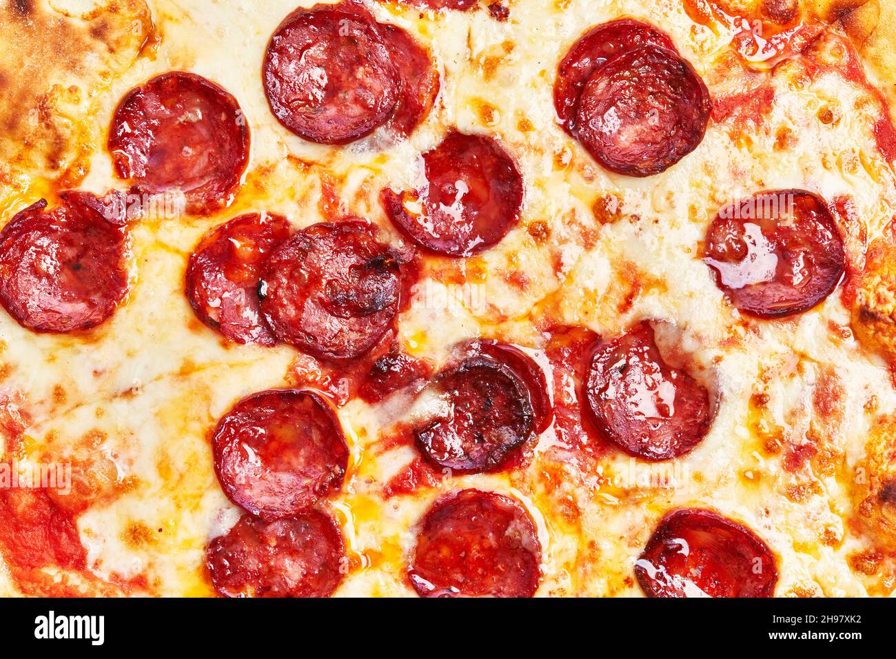 Single pepperoni italian pizza texture Stock Photo - Alamy