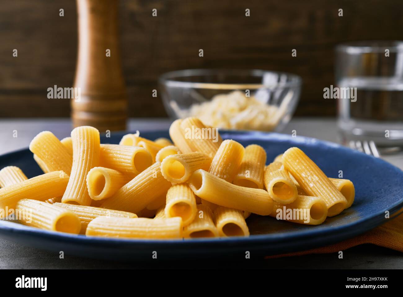 Plate of macaroni italian pasta on a concrete surface Stock Photo - Alamy