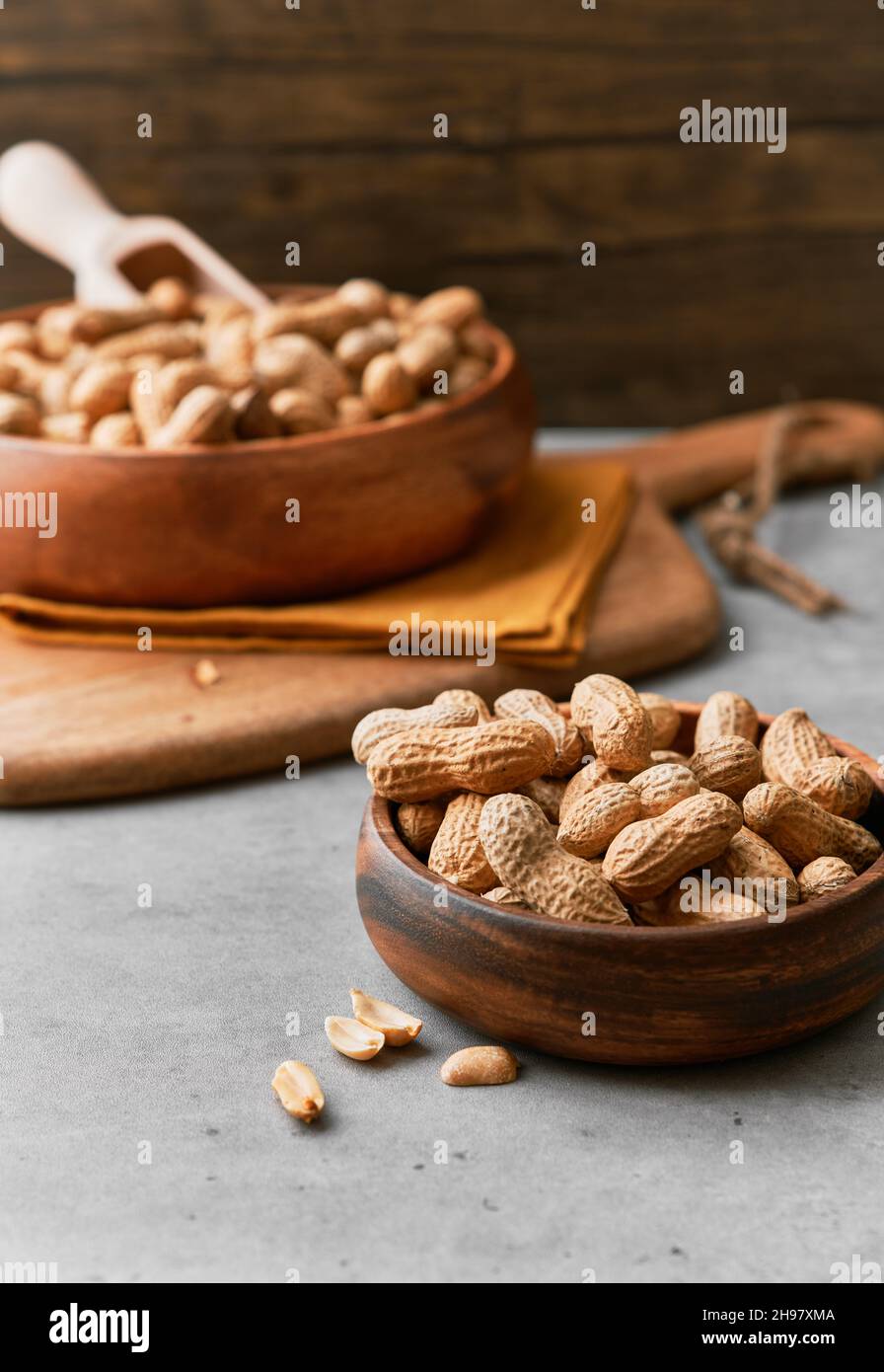 Image of bunch of peanuts in a bowl on a concrete surface Stock Photo ...
