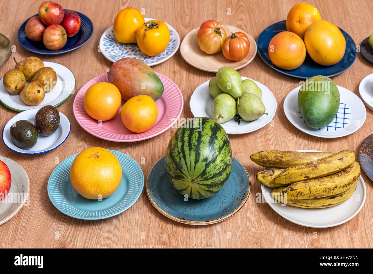 Still life with plates full of all kinds of ripe fruits to eat with ...