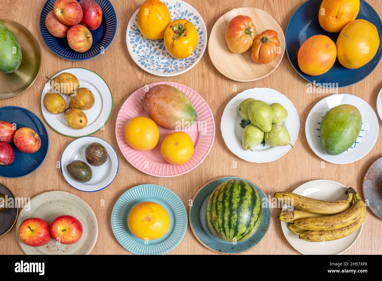 Still life top view image with plates full of all kinds of ripe fruits ...