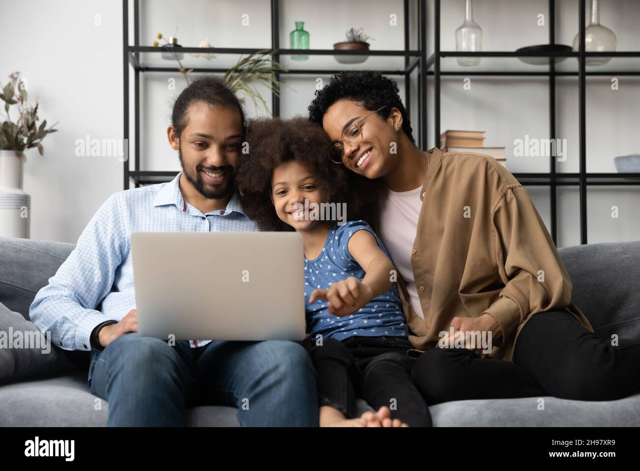 Happy African American family using computer at home Stock Photo - Alamy