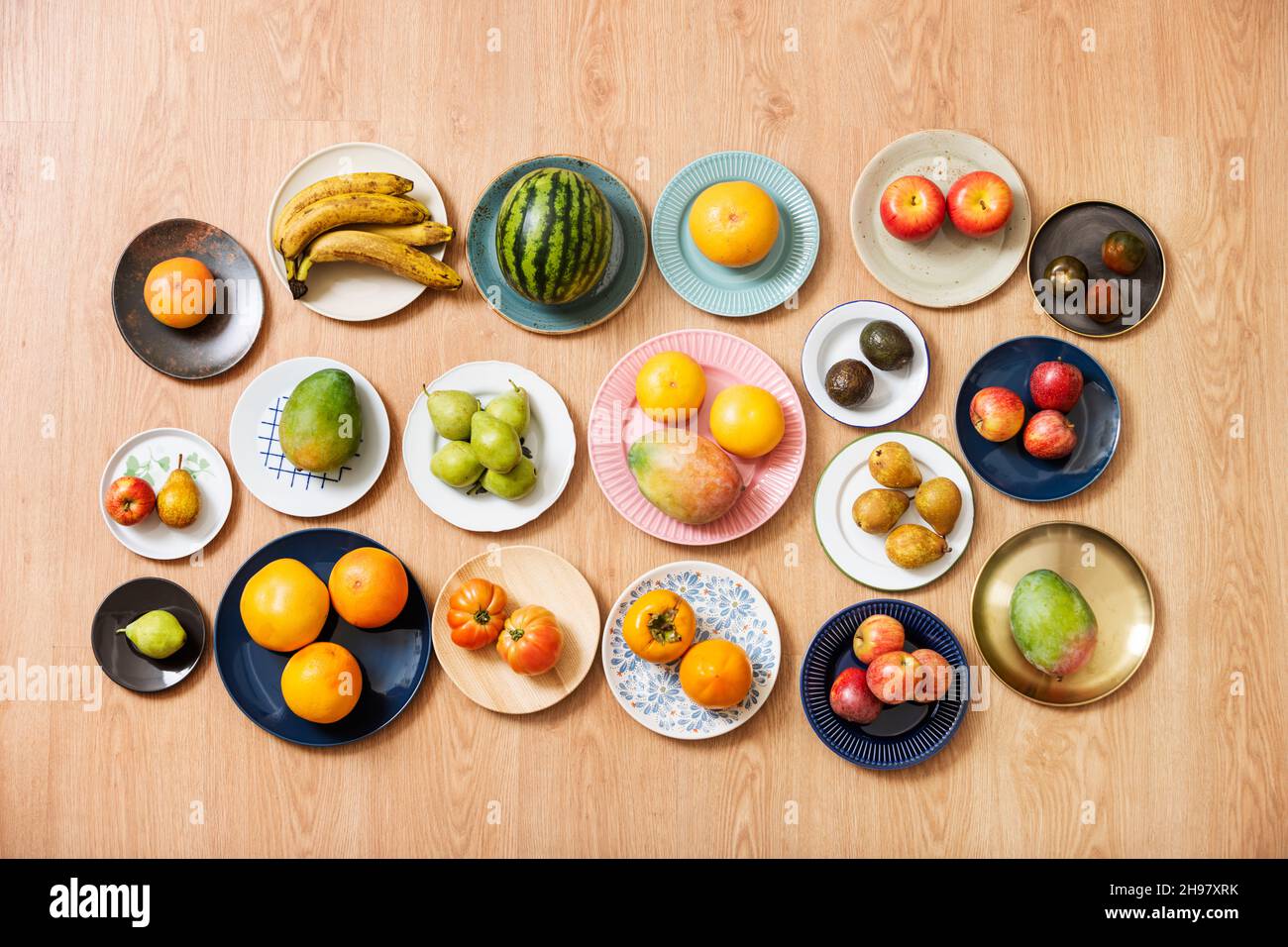 Still life top view image with plates full of all kinds of ripe fruits ...