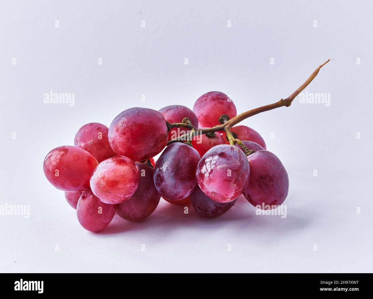 Bunch of grapes isolated over white background Stock Photo - Alamy