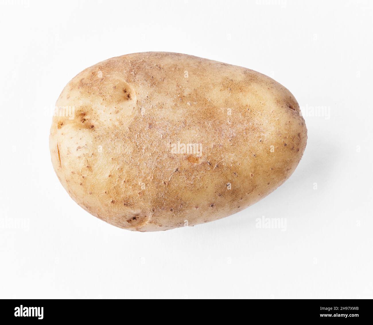 SIngle potato isolated on a white background Stock Photo - Alamy