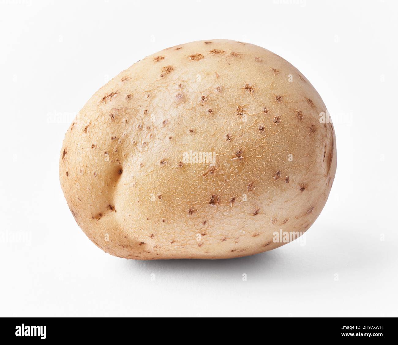 SIngle potato isolated on a white background Stock Photo - Alamy