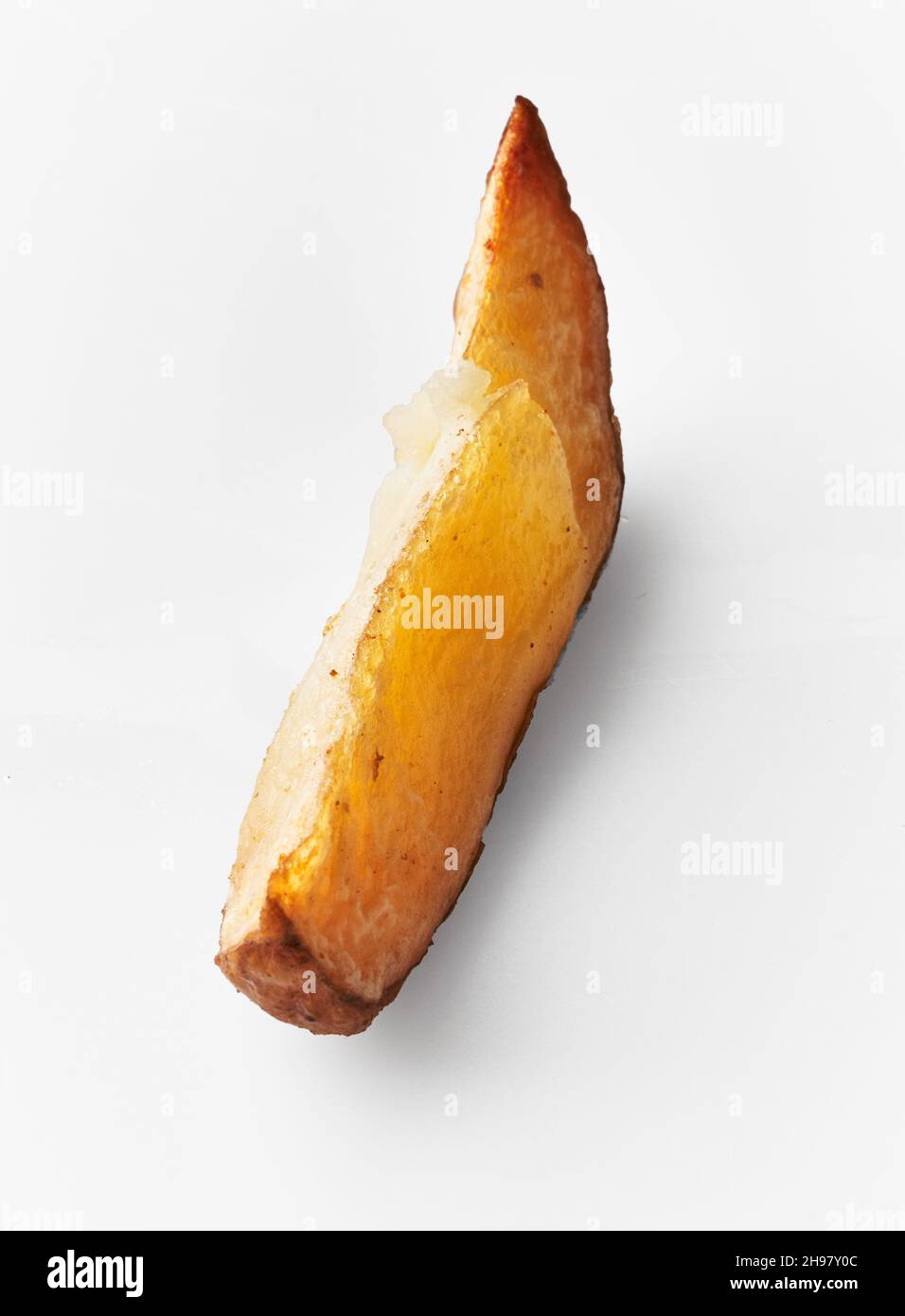 Single slice of baked potato isolated on a white background Stock Photo ...