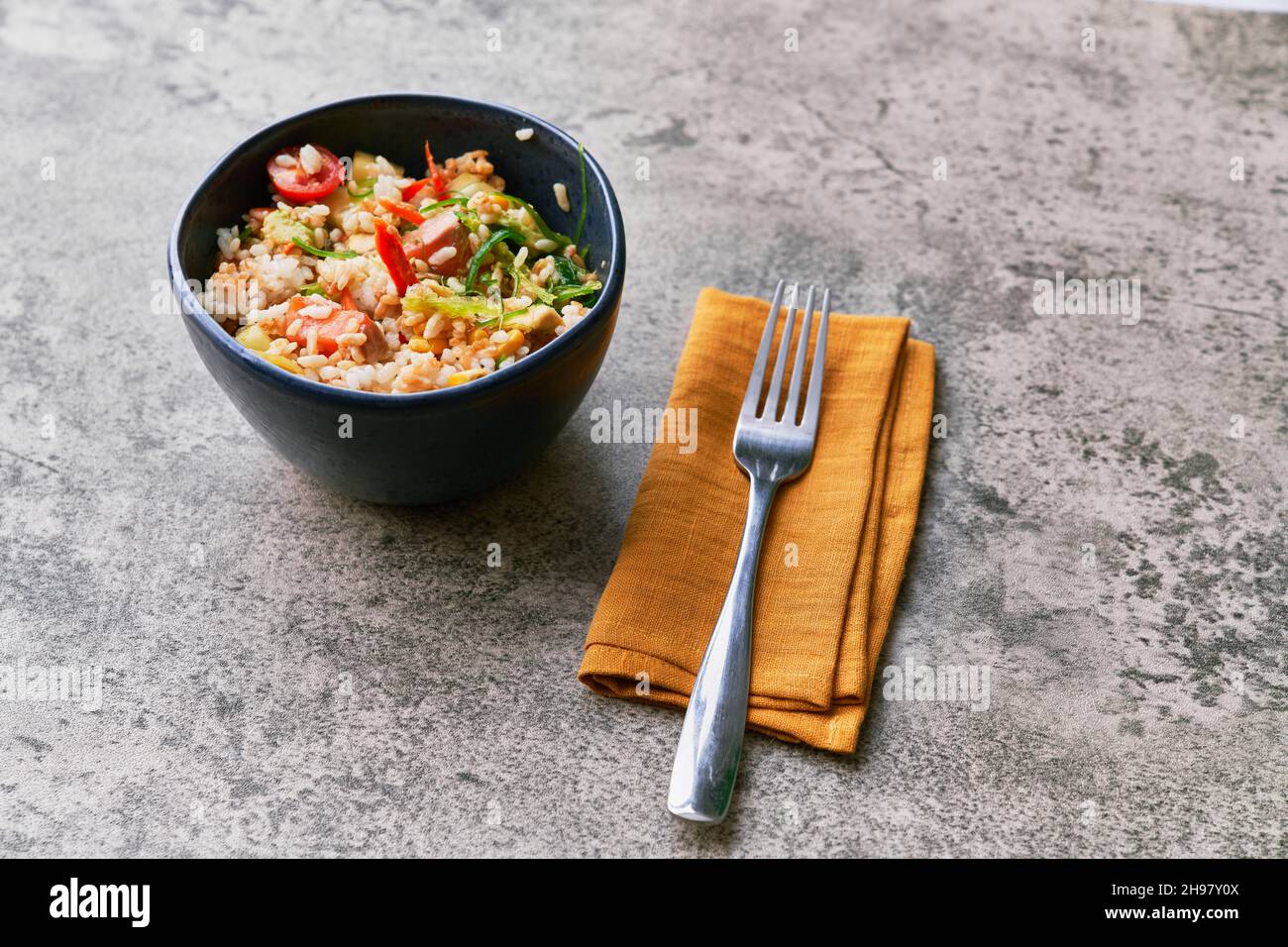Delicious poke bowl on a concrete surface Stock Photo - Alamy