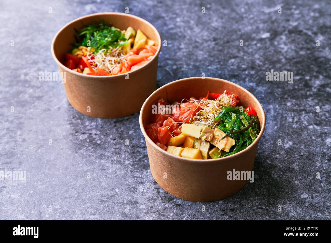 Delicious take away poke bowls on a concrete surface Stock Photo - Alamy