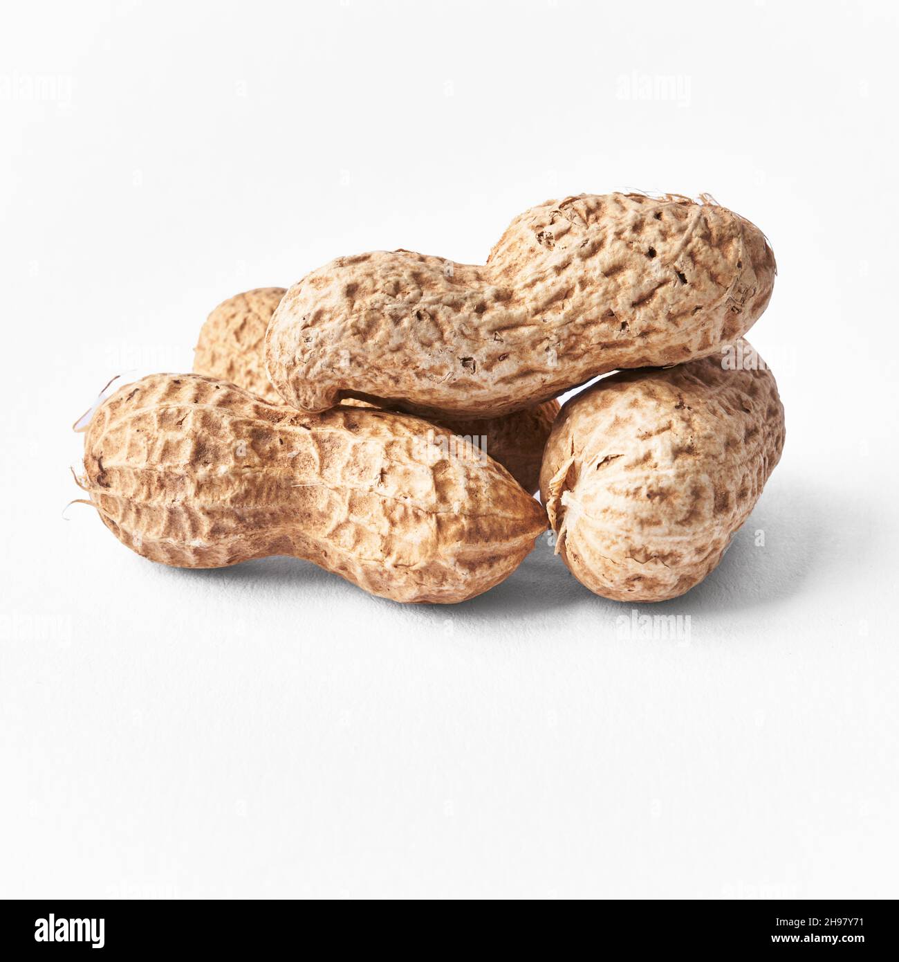 Bunch of peanuts with shell isolated on a white background Stock Photo ...
