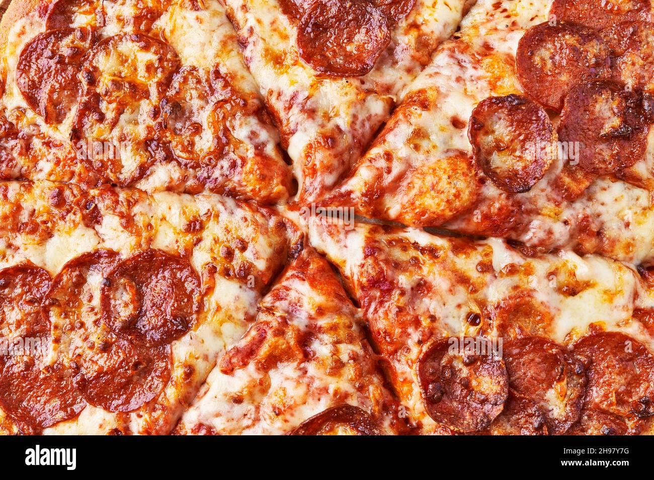 Delicious pepperoni italian pizza texture Stock Photo - Alamy