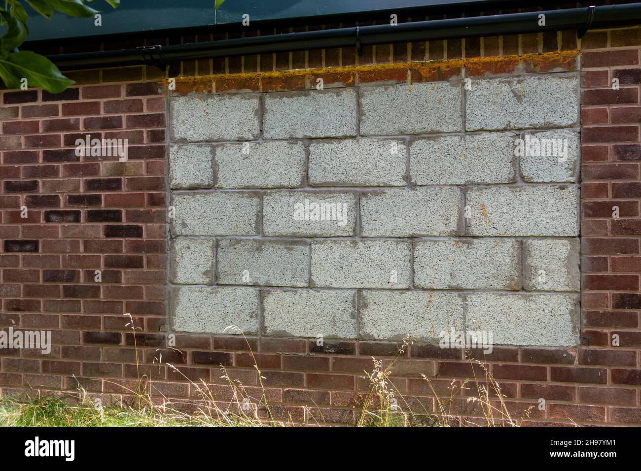 Window space in a brick wall, blocked up with concrete blocks Stock ...