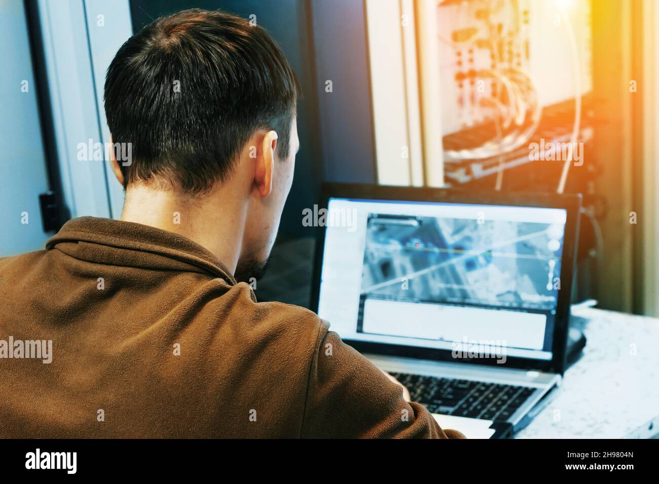 An IT specialist has been working on a laptop in a data center for 30 ...