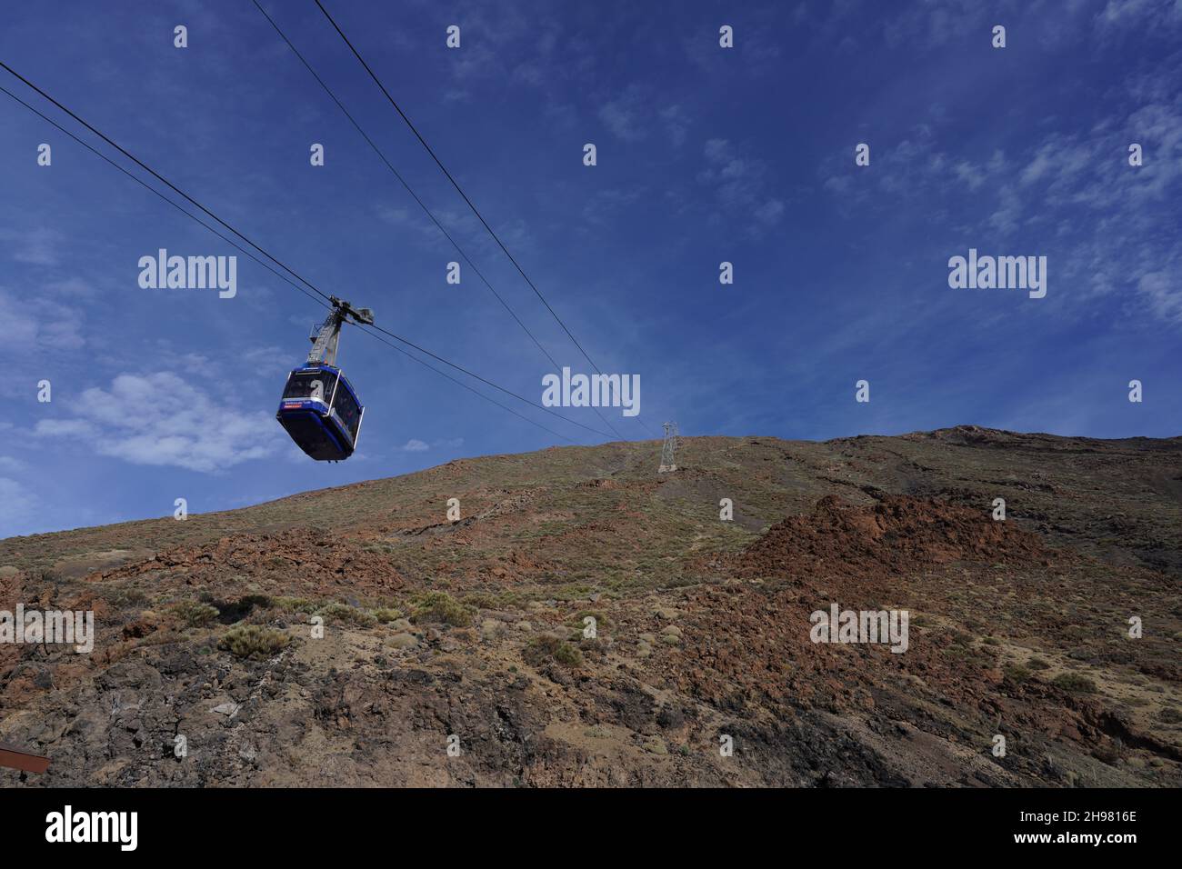 A scenic view of a long ropeway on blue sky background Stock Photo - Alamy