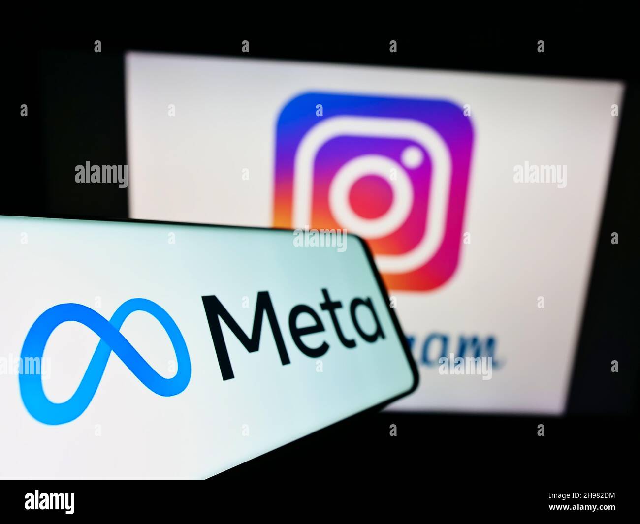 Cellphone with logo of American technology company Meta Platforms Inc ...