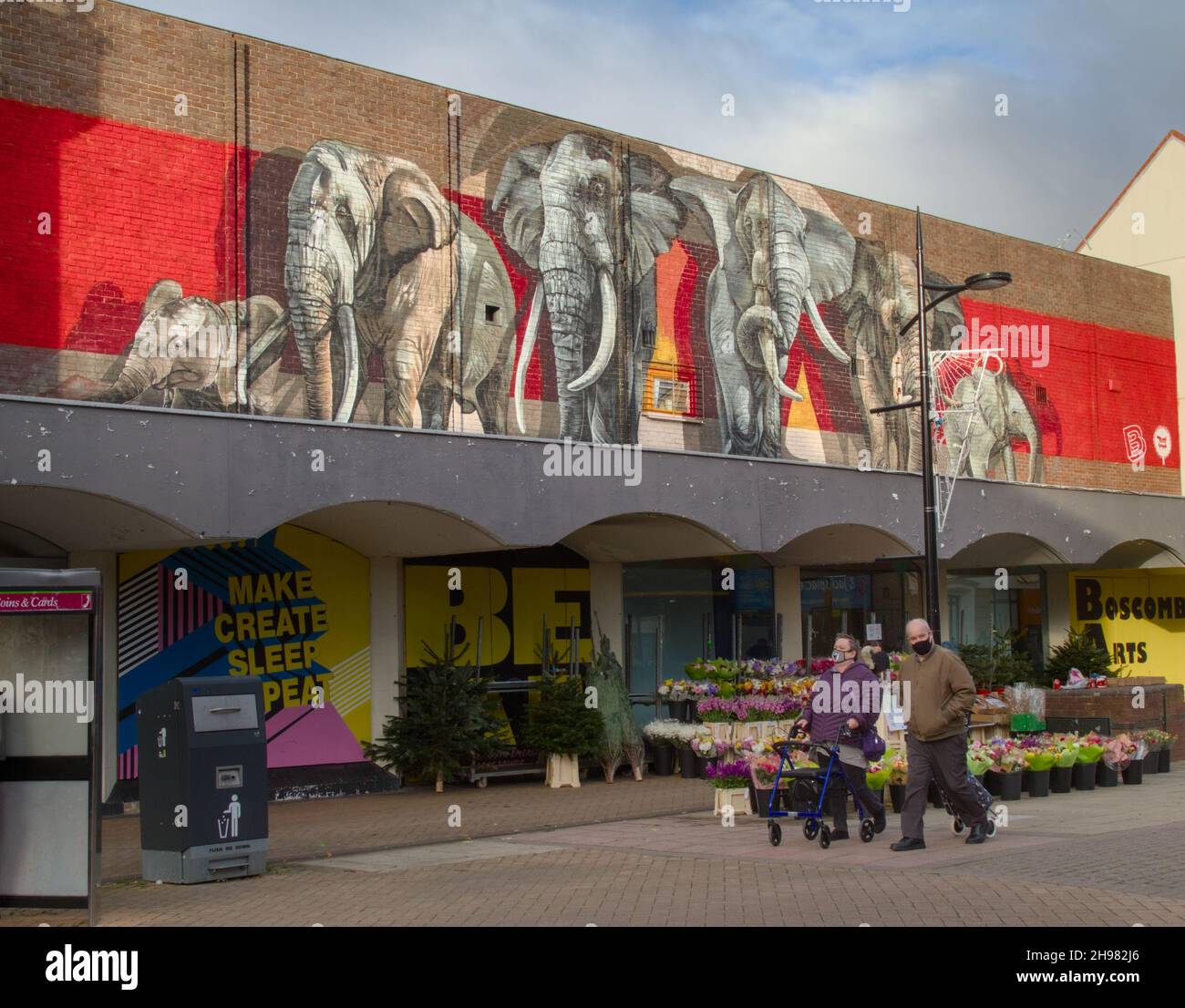 People Walking Past Boscombe Arts Centre With Mural Of A Herd Of ...