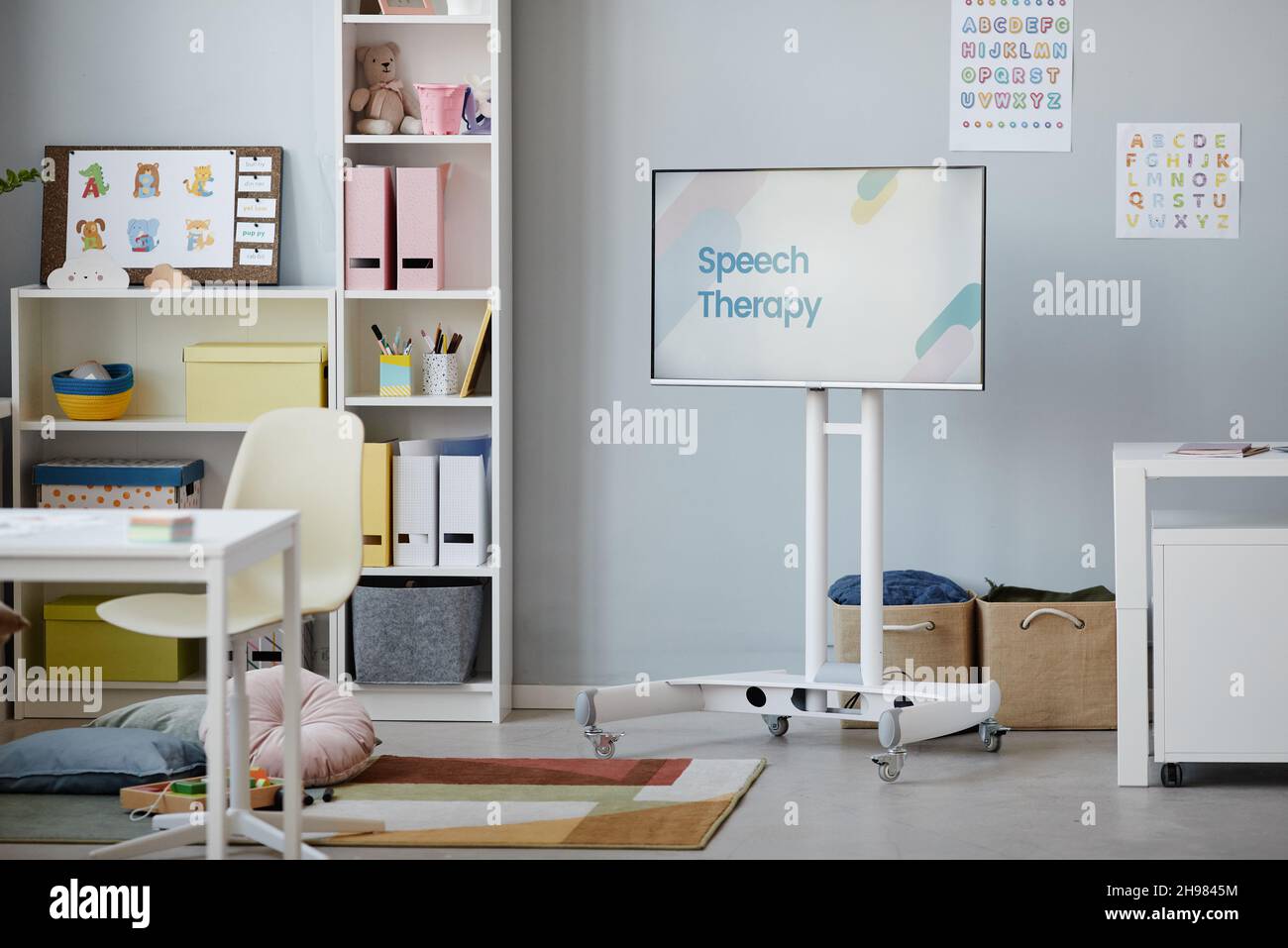 Image of modern classroom with whiteboard and English alphabet on the ...