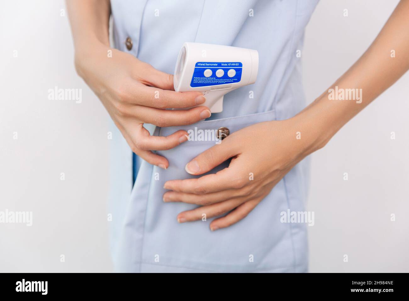 Temperature measurement gun in doctor hands. Close-up shot of doctor ...