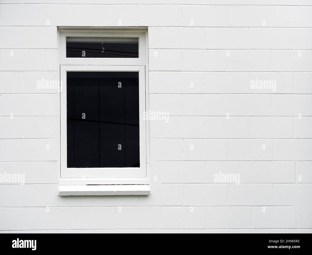 View of divided vertical awning window on white brick wall Stock Photo ...
