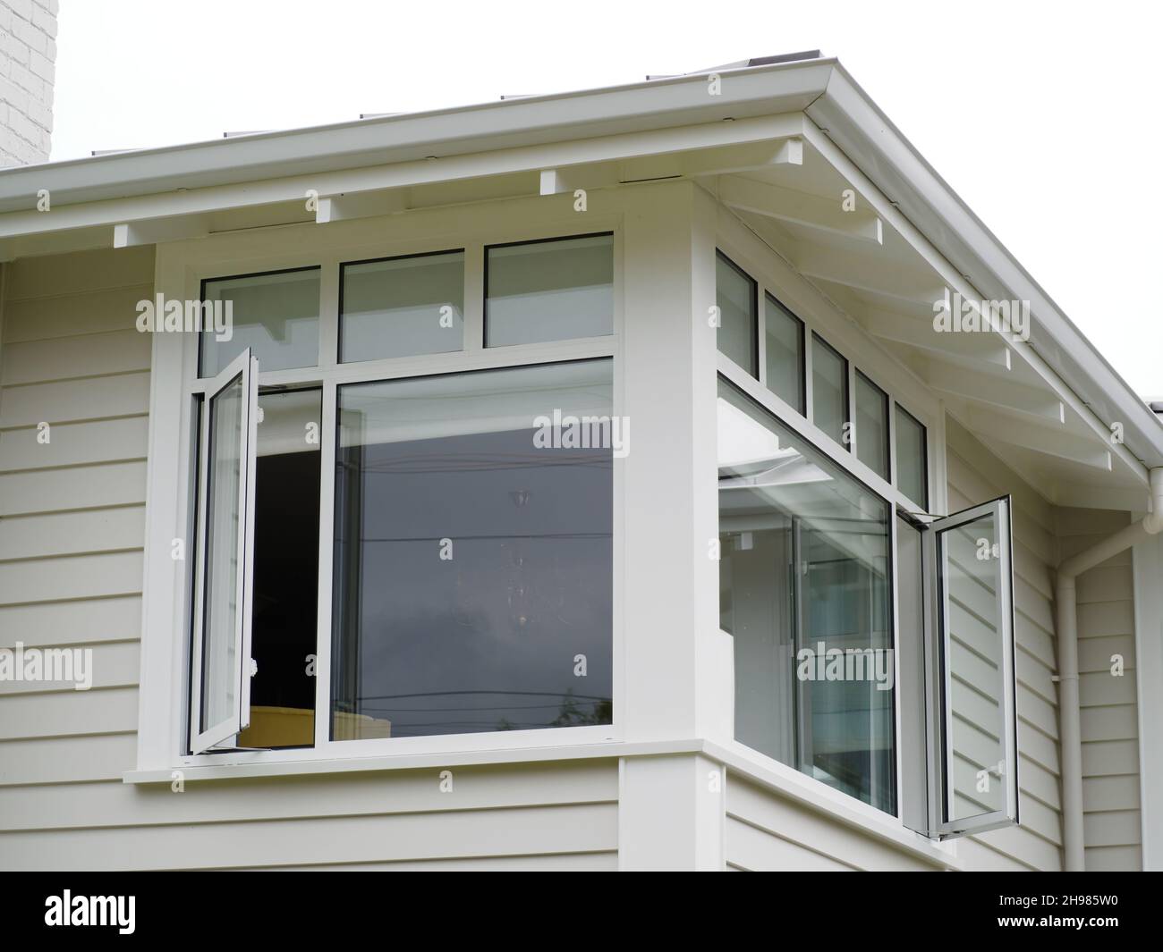 Outside view of corner window. Wooden weatherboard house Stock Photo ...