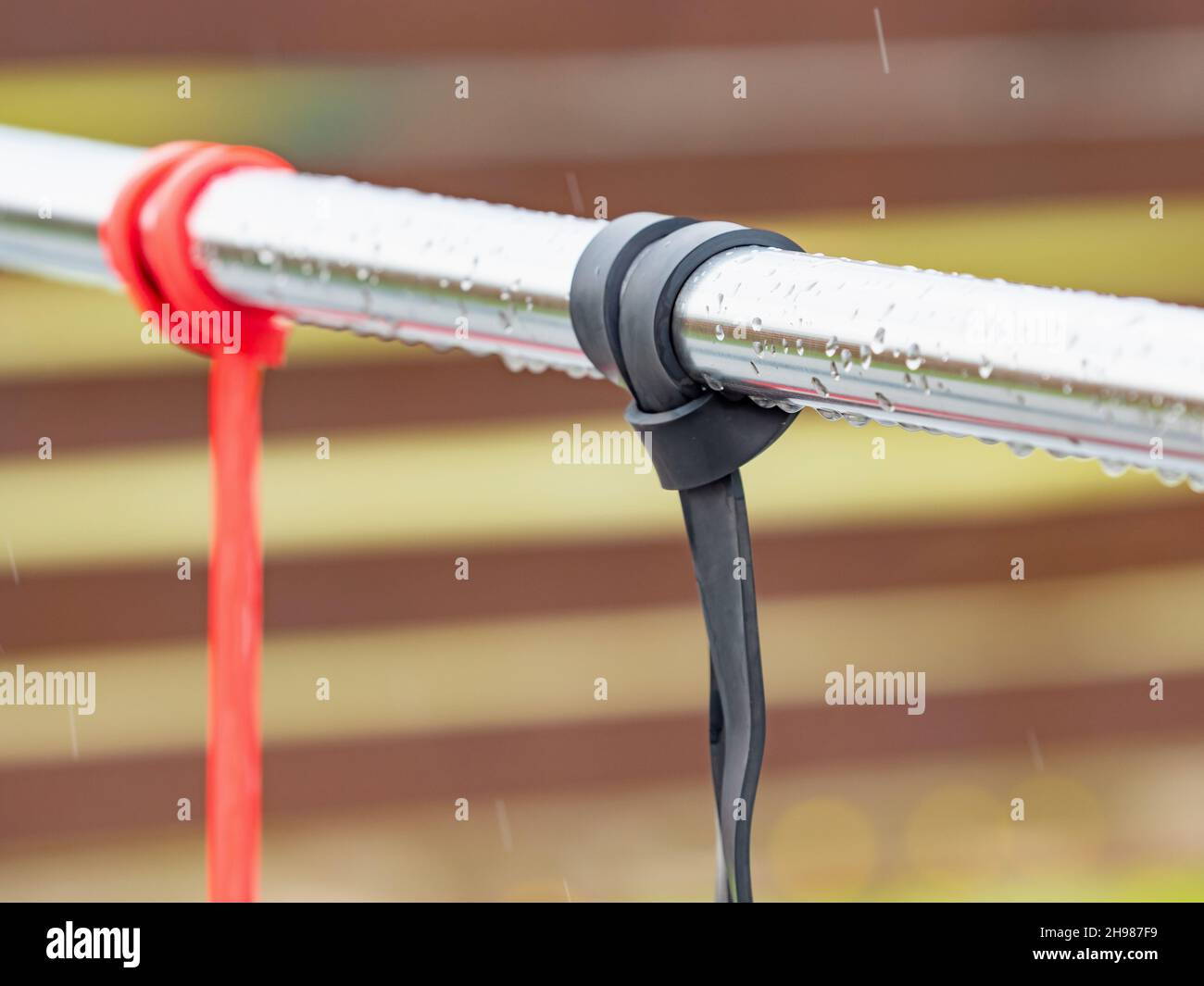 Exercise and stretching rubber elastic bands hanging on a workout rail ...