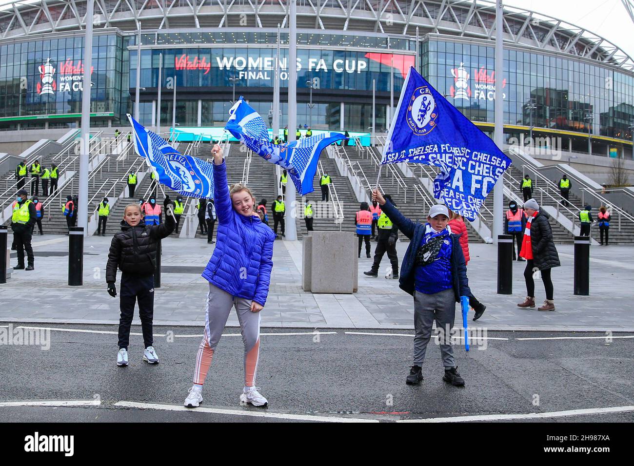 Young Chelsea fans waving their flags outside Wembley Stadium in London ...