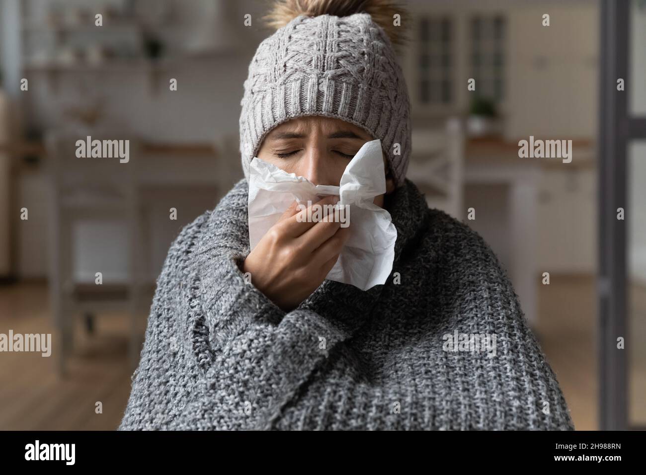 Close up sick woman blowing nose, using paper napkin Stock Photo - Alamy