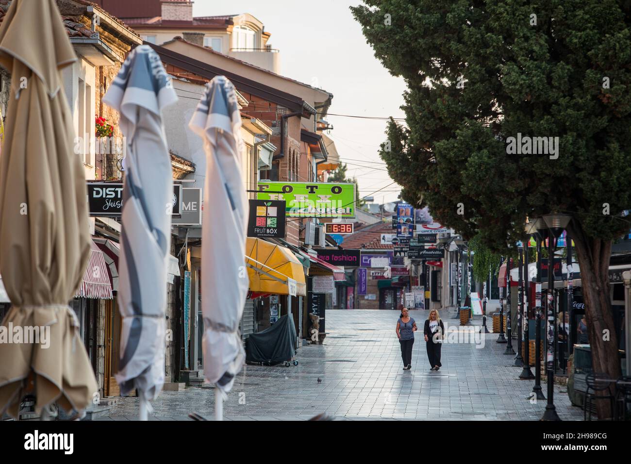 OHRID, NORTH MACEDONIA - August 25, 2021: People walk down one of the ...