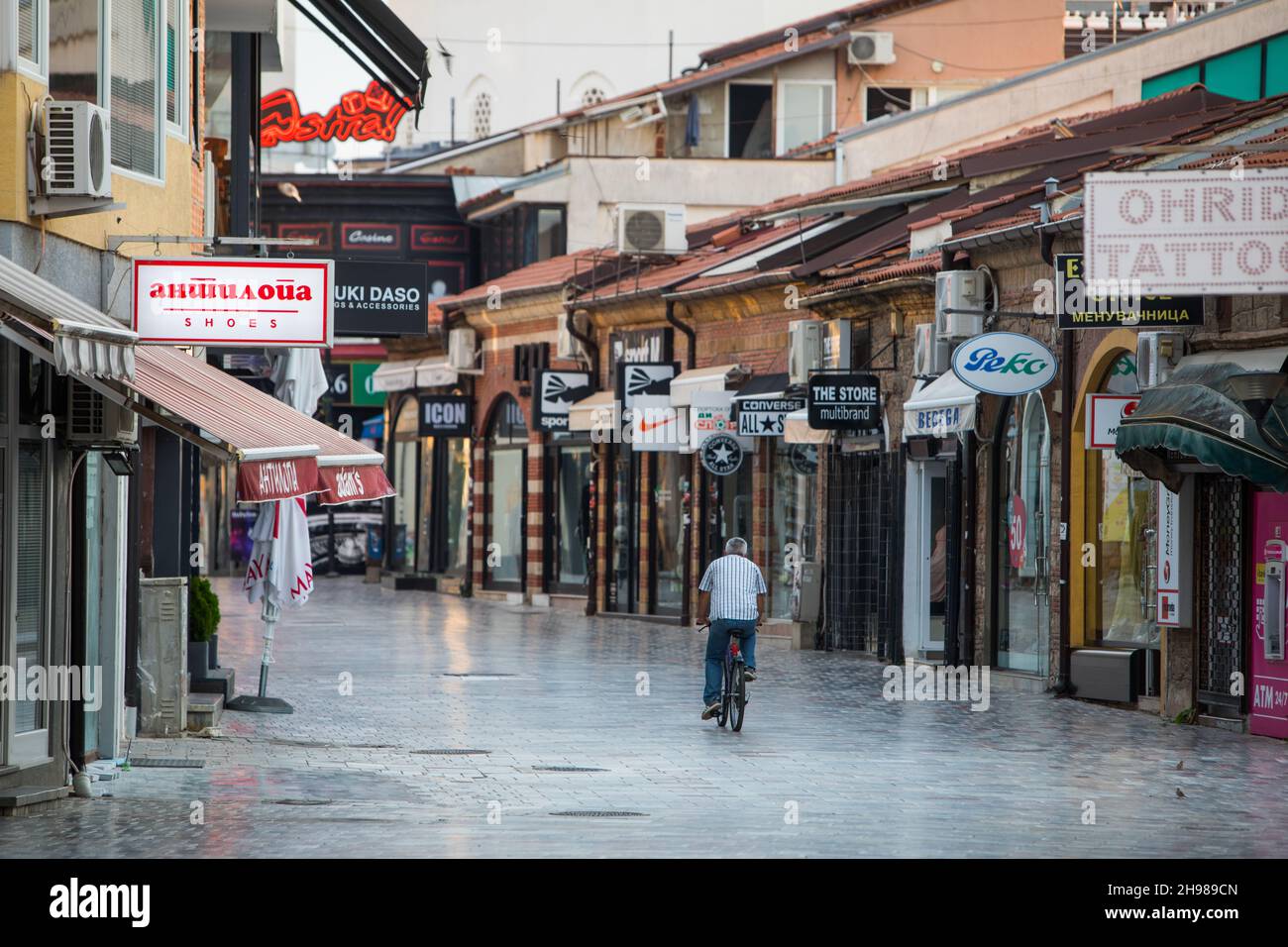 OHRID, NORTH MACEDONIA - August 25, 2021: People walk down one of the ...