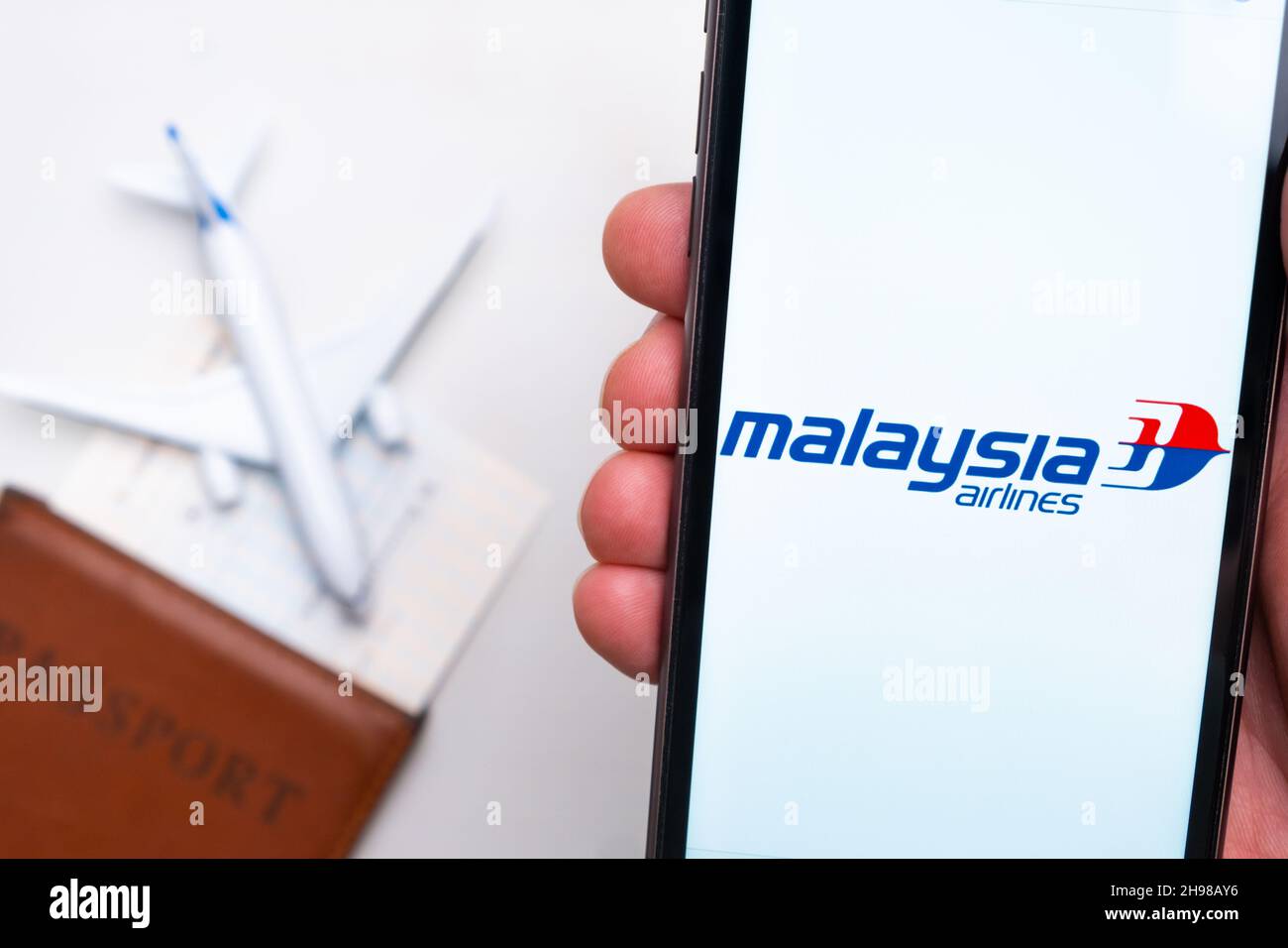 Malaysia Airlines logo on the mobile phone screen with a plane ...