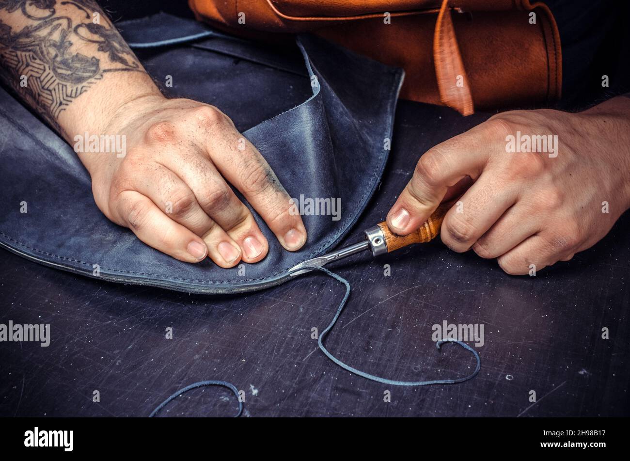 Currier of leather creates quality product of leather at his tanning ...