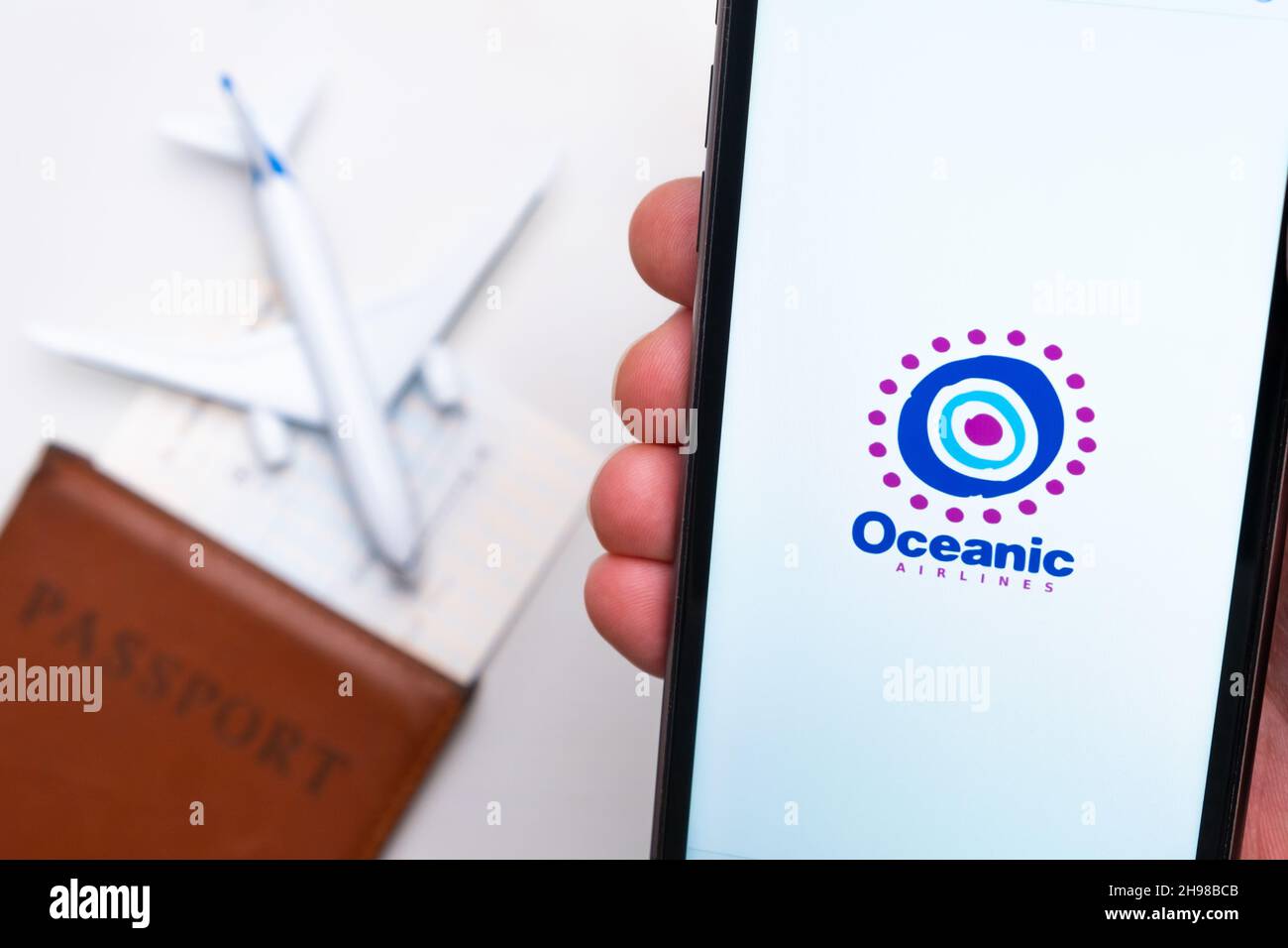 Oceanic Airline logo on the mobile phone screen with a plane, passport ...