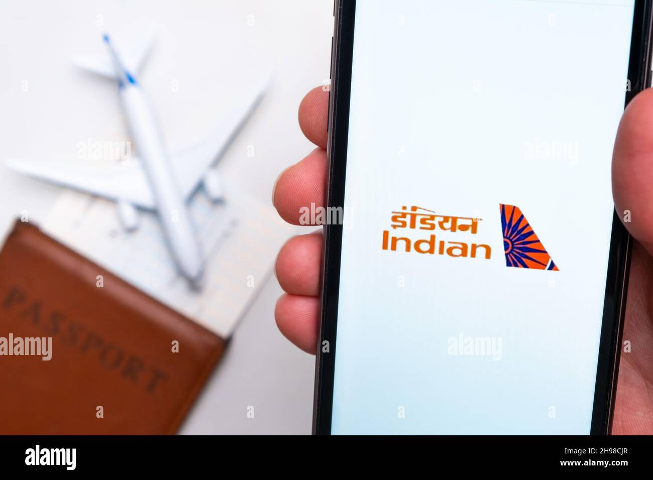 Indian Airline application is displayed on the smartphone screen. There ...