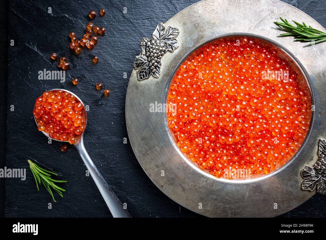 Delicious red caviar in vintage plate, top view, dark background Stock ...