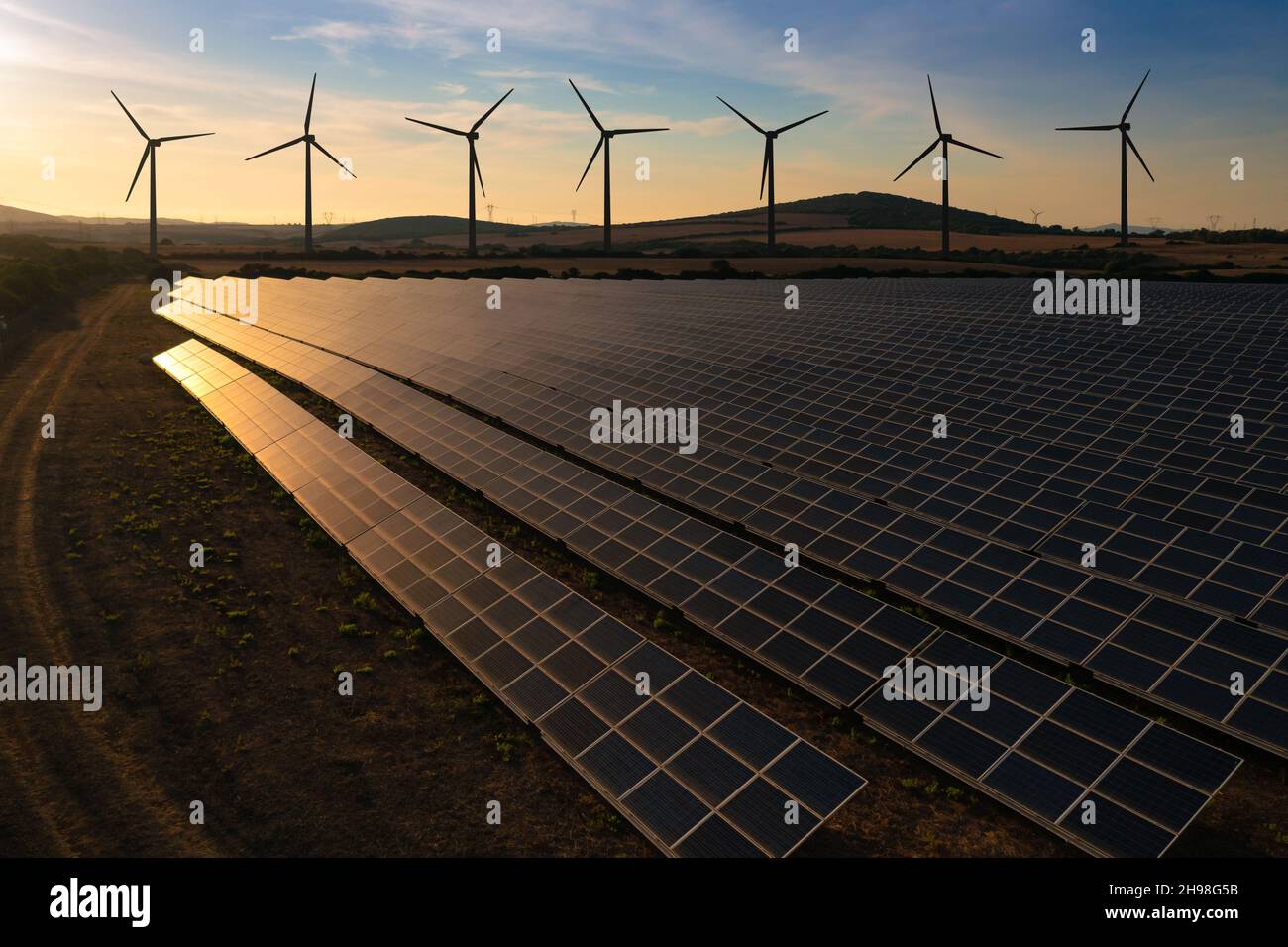 Solar panels and wind turbines generating renewable energy for green ...