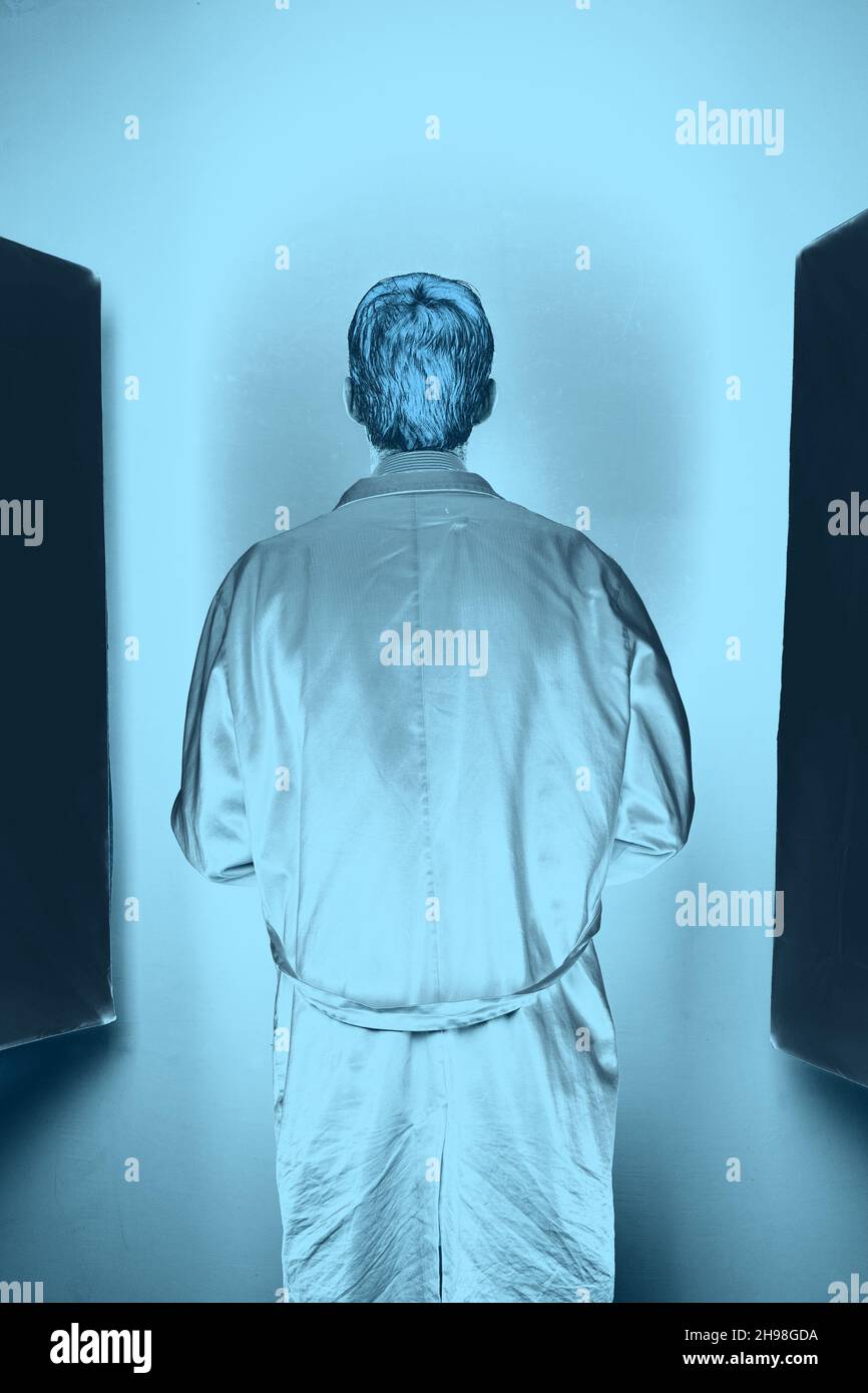 A vertical shot of a back view of the male wearing a coat Stock Photo ...