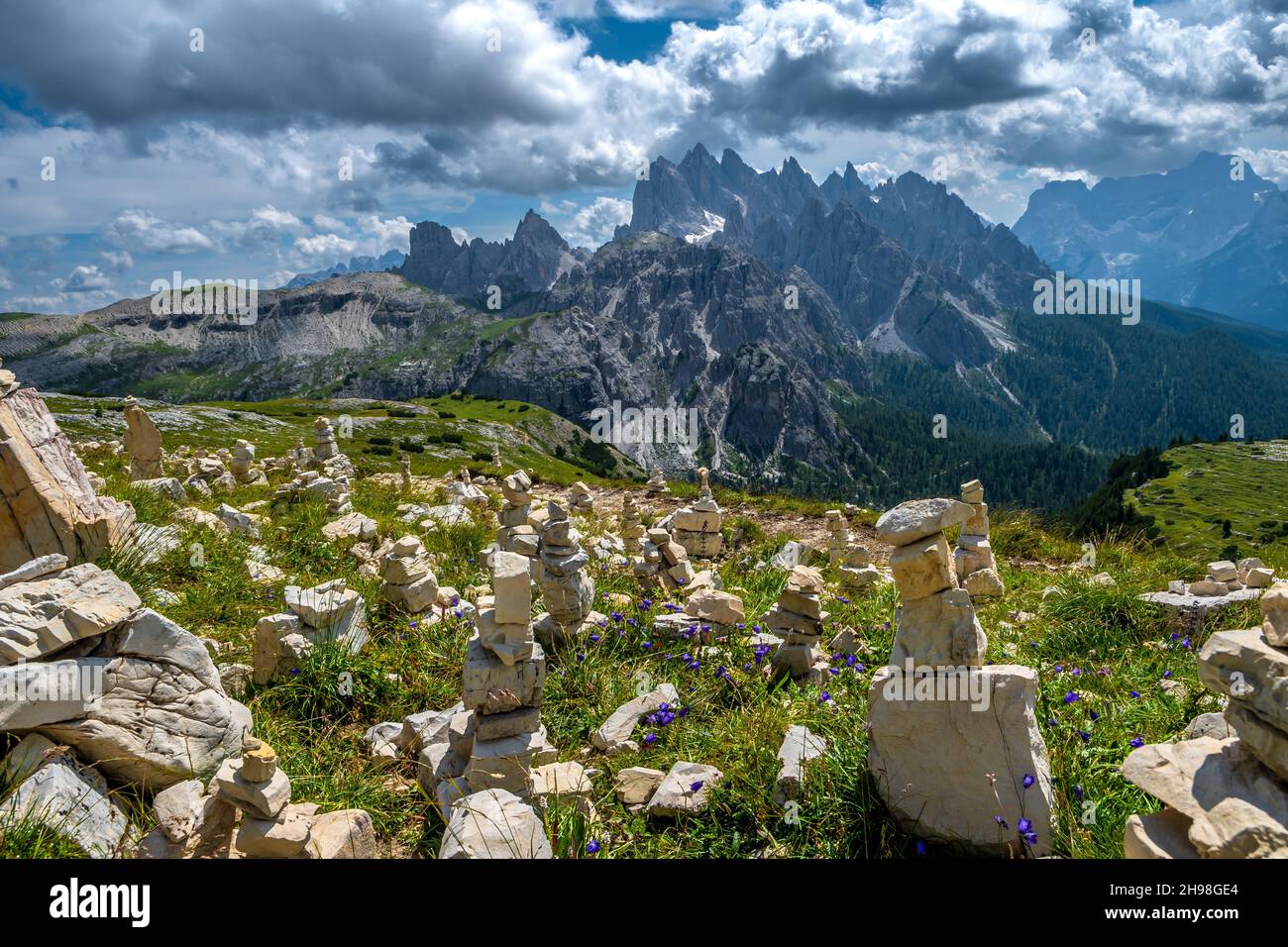 Stone Sculptures In Alpine Landscape With Mountain Peaks In The ...