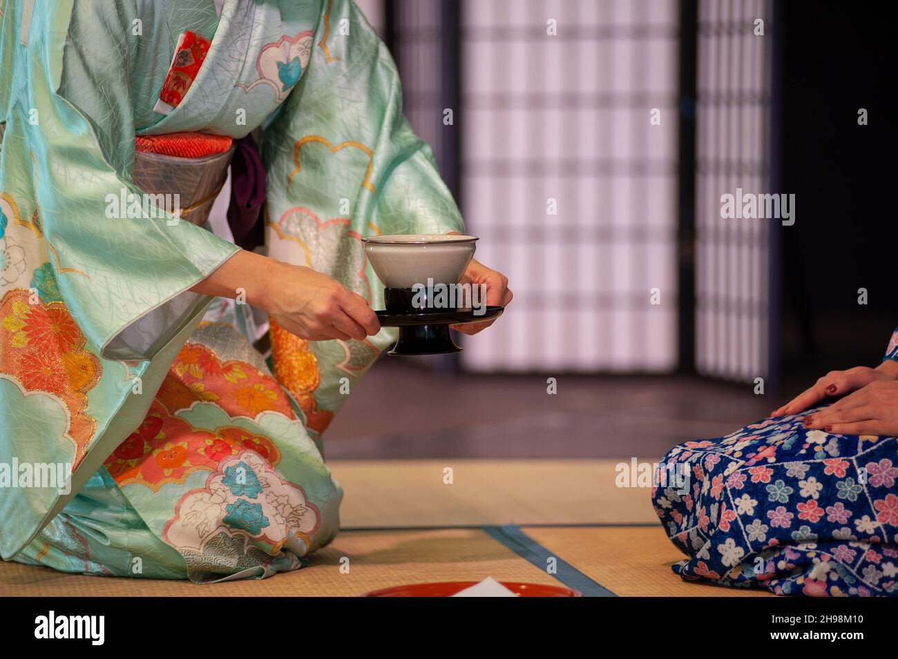Japanese woman in traditional kimono, kneeling on Seiza position ...